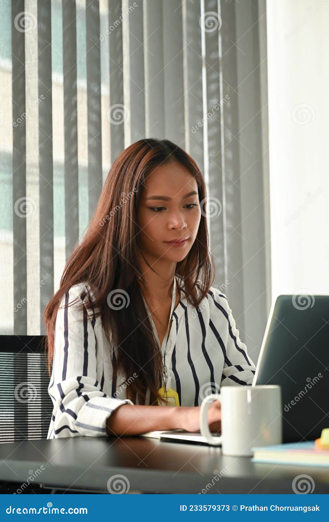 Female Office Worker Working with Laptop Computer in Office. Stock ...
