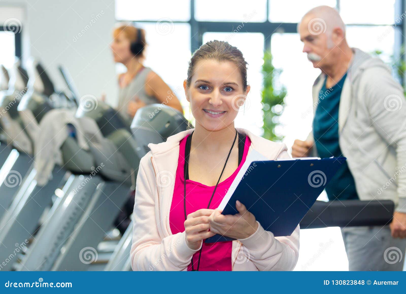 Beautiful Female Personal Trainer at Gym Stock Photo - Image of clothes ...