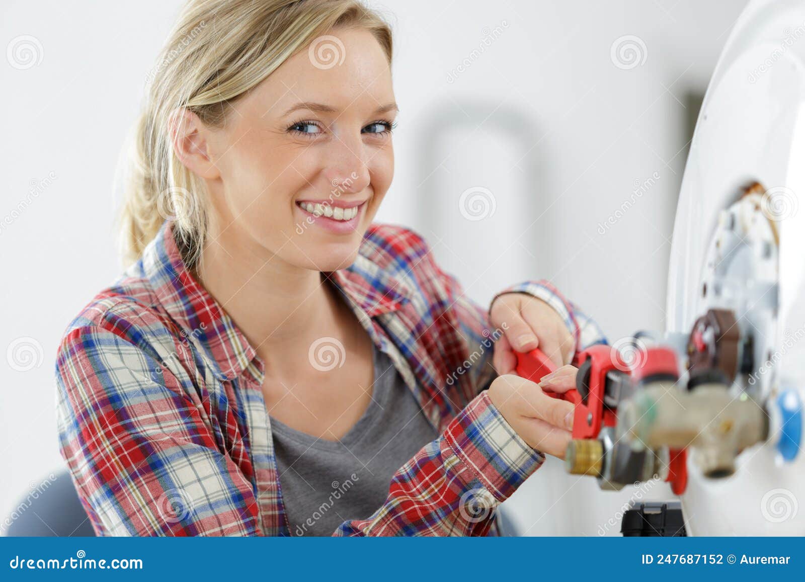 Beautiful Female Plumber Working on Central Heating Boiler Stock Photo ...