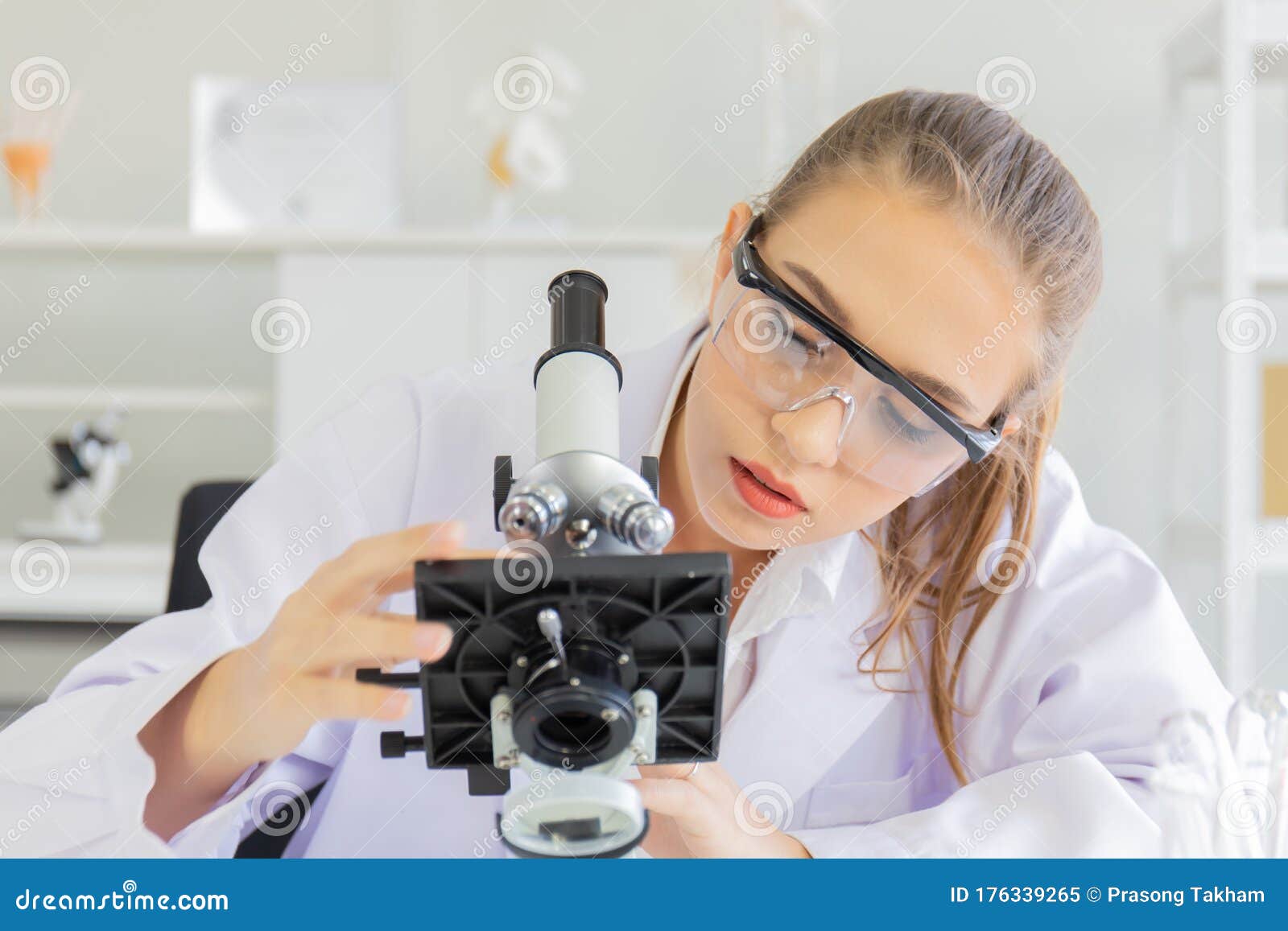 Beautiful Female Scientist is Operating in a Science Lab with Various ...