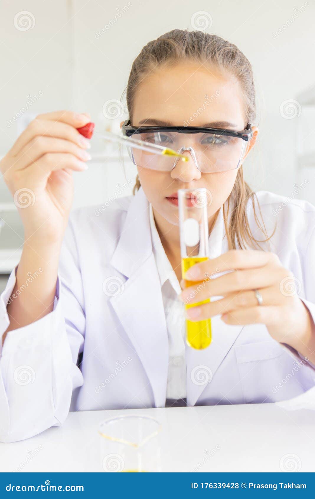 Beautiful Female Scientist is Operating in a Science Lab with Various ...