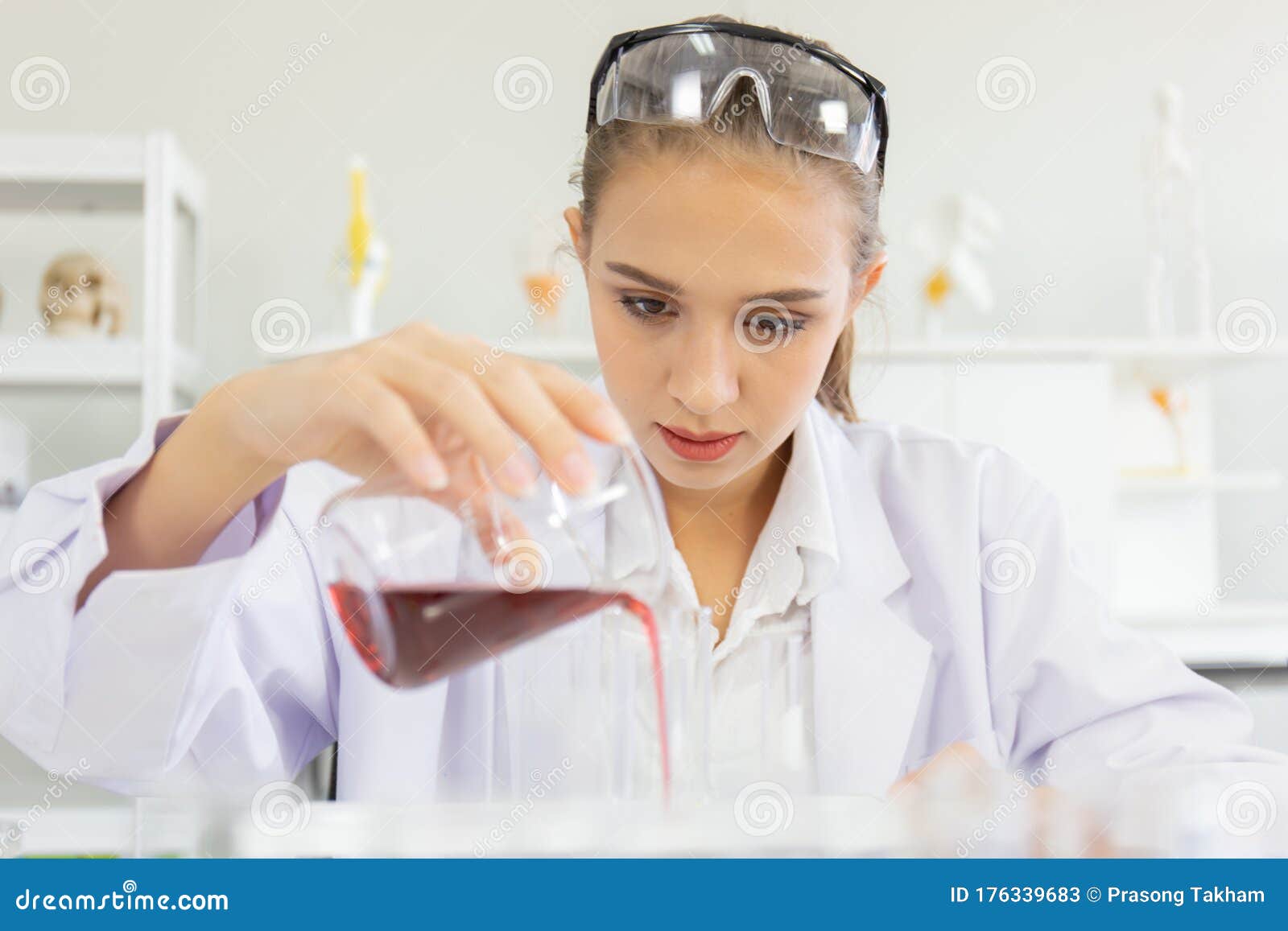 A Beautiful Female Scientist is Operating in a Science Lab with Various ...