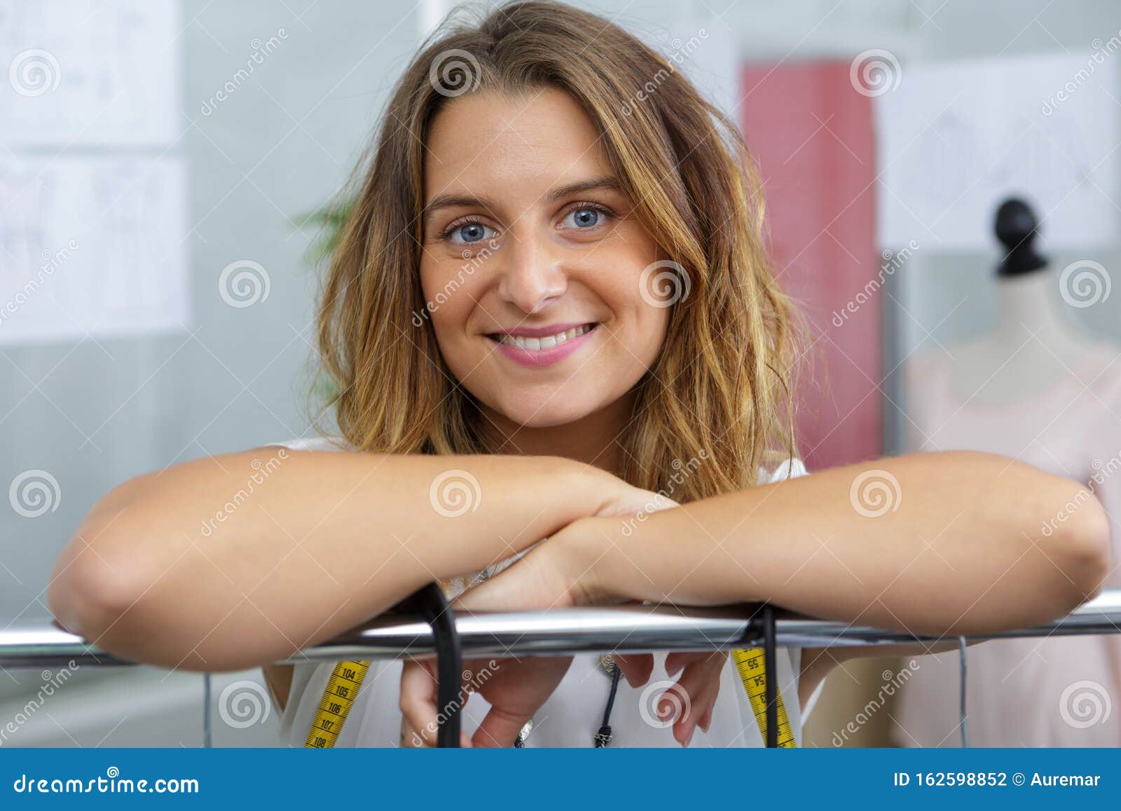 Beautiful Female Shop Assistant Looking at Camera Stock Photo - Image ...
