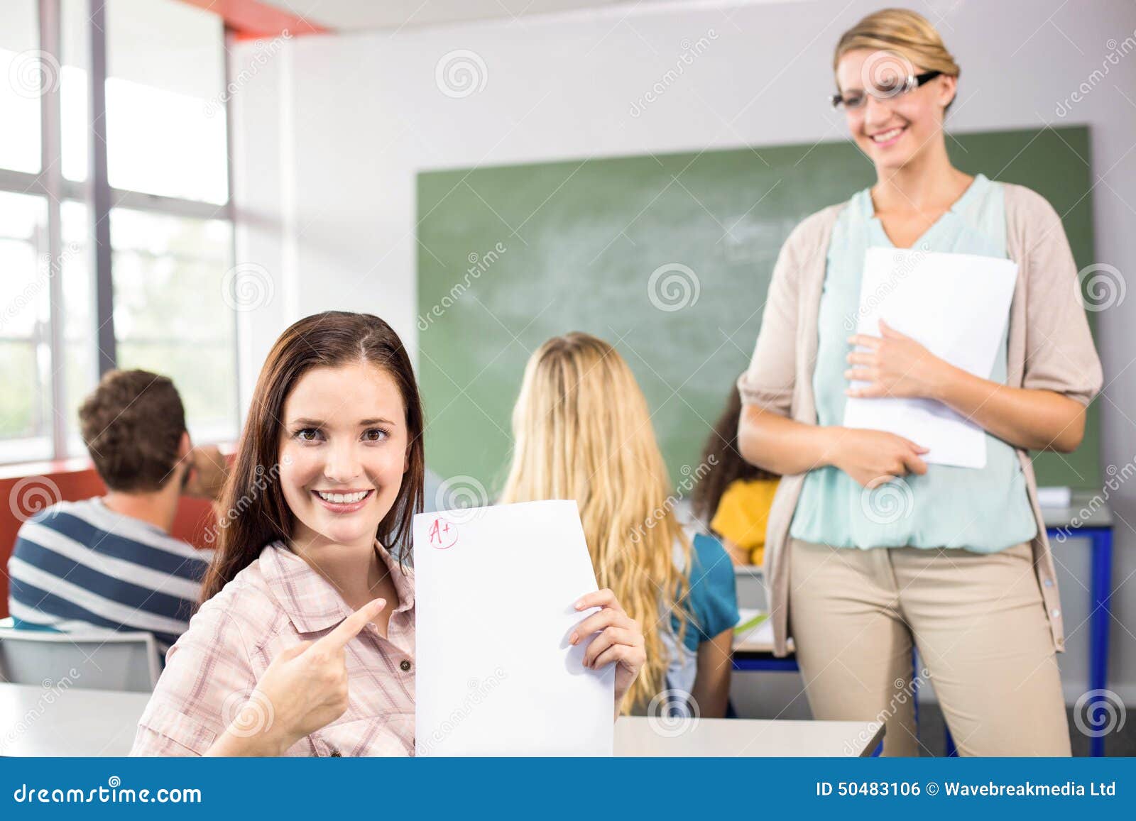 Beautiful Female Student Pointing at Paper Stock Photo - Image of ...