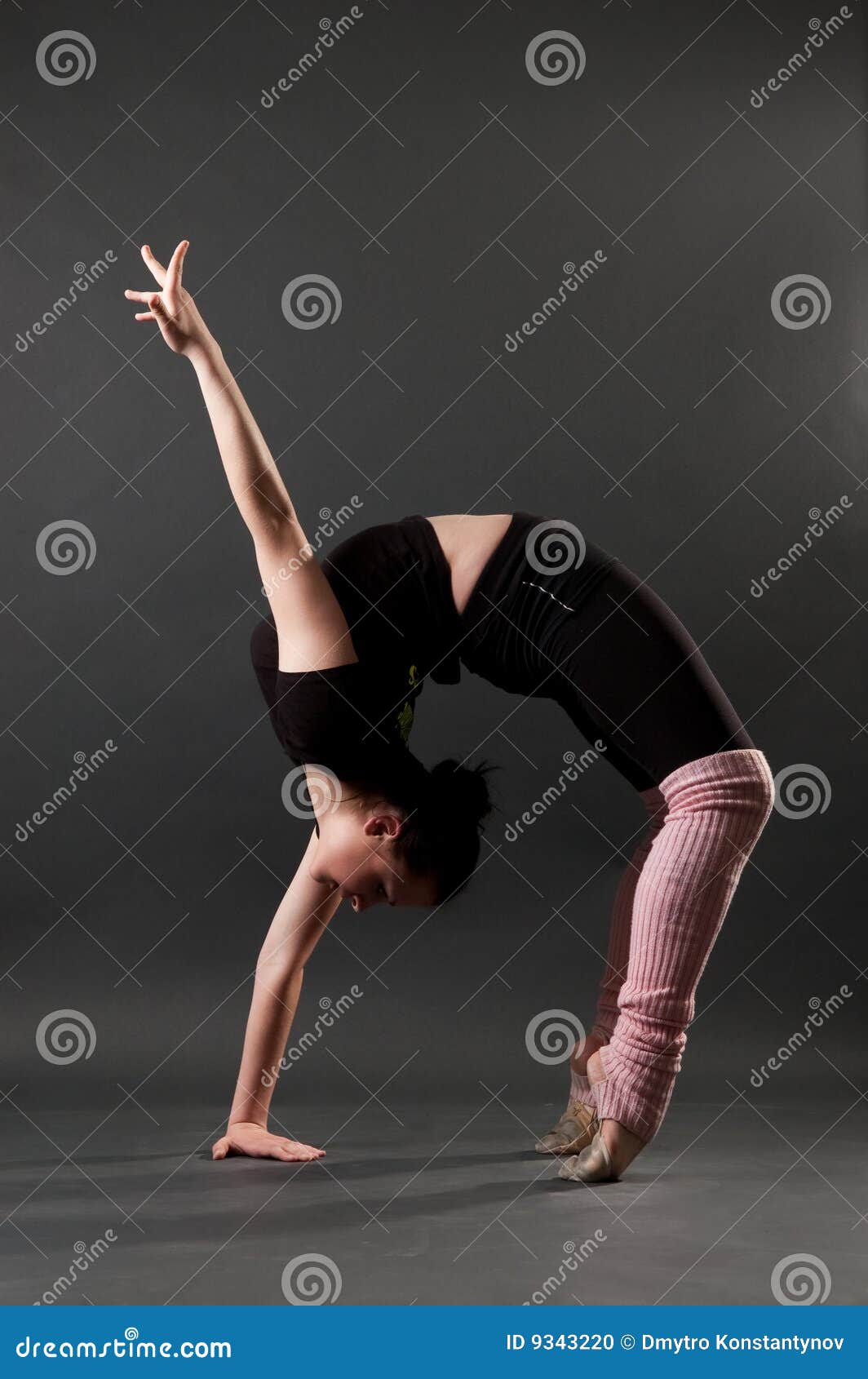 Flexible Gymnast Girl In A Beautiful Pose On A Background Of ...
