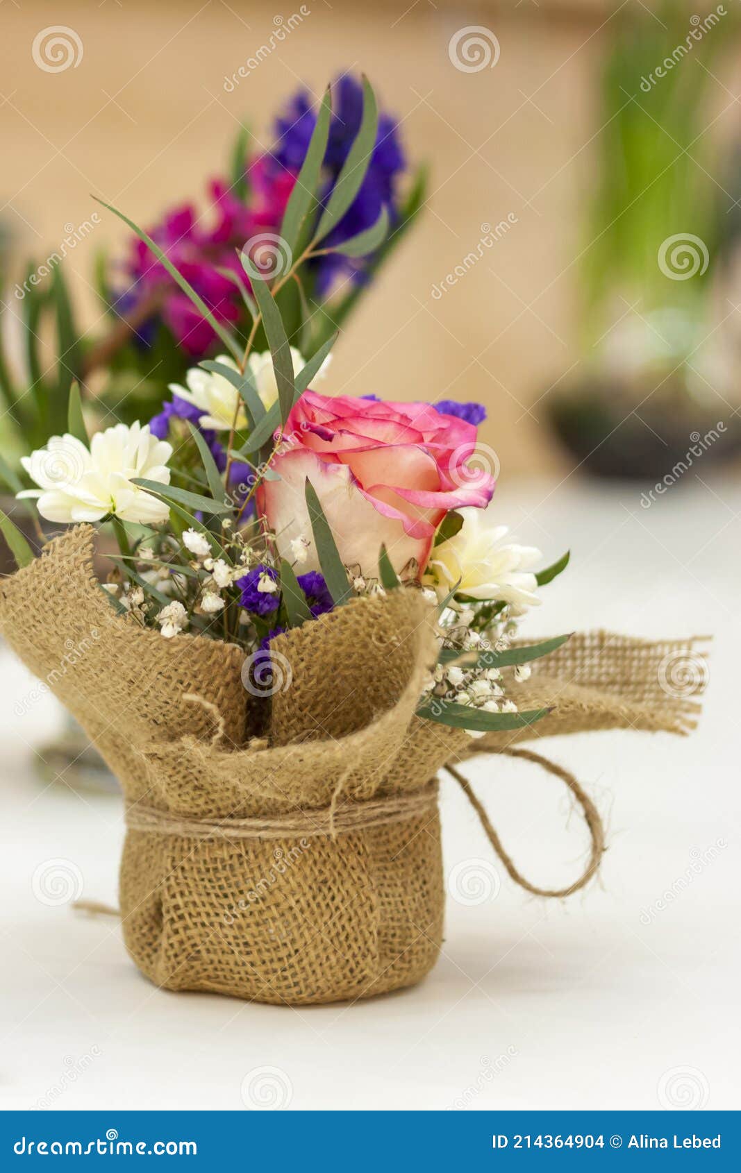 Beautiful Flower Arrangement in a Pot Wrapped in Burlap Stock Photo ...