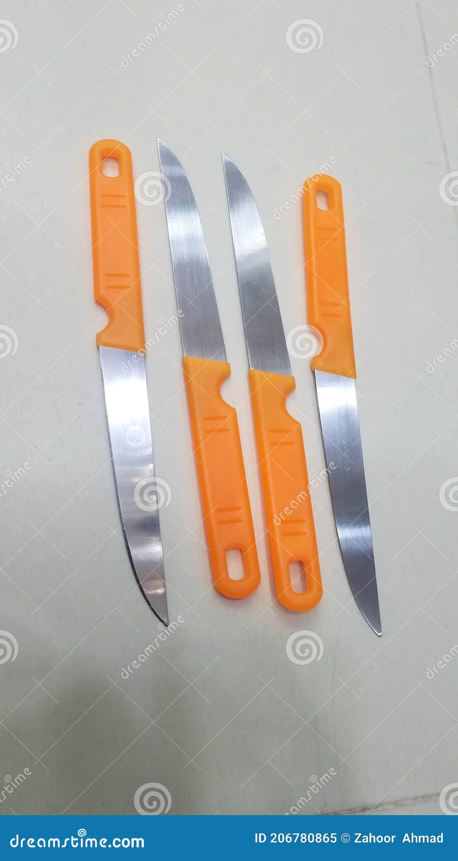 Beautiful Four Nife in Orange Color on the Floor Stock Image - Image of ...