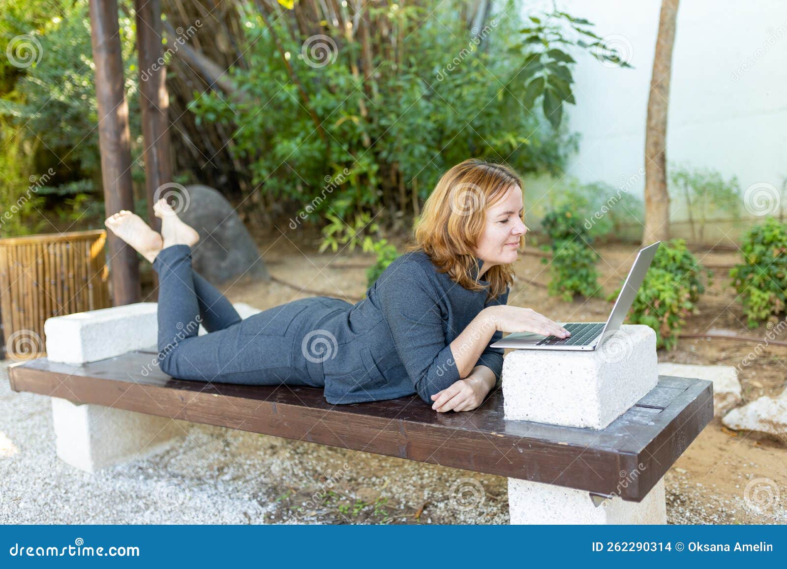 A Beautiful Freelancer Woman Works at the Park Stock Photo - Image of ...