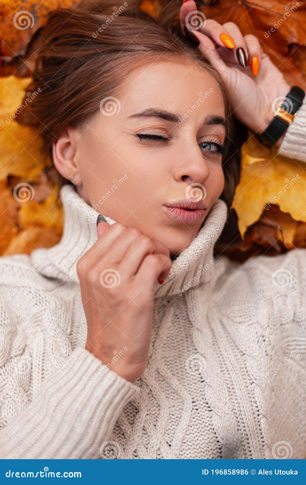 Beautiful Funny Happy Young Woman Winks Looking At The Camera Portrait