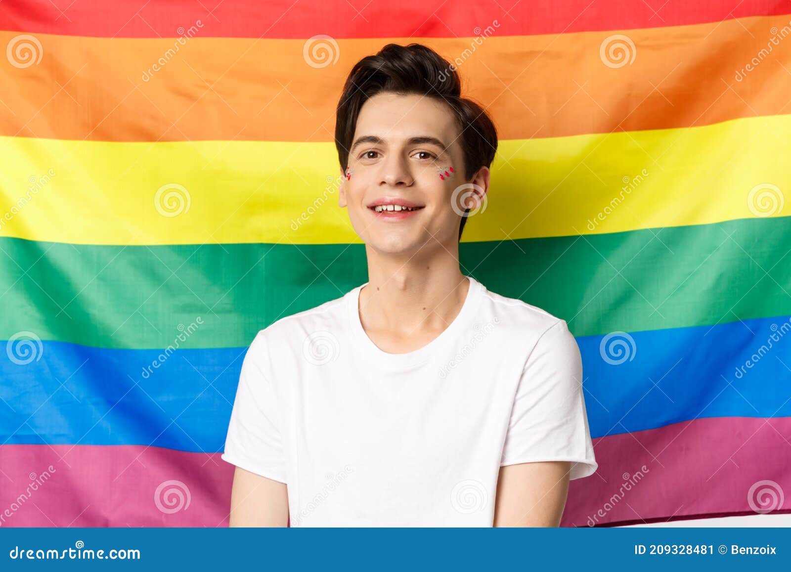 Beautiful Gay Man With Glitter On Face Smiling Happy And Proud At