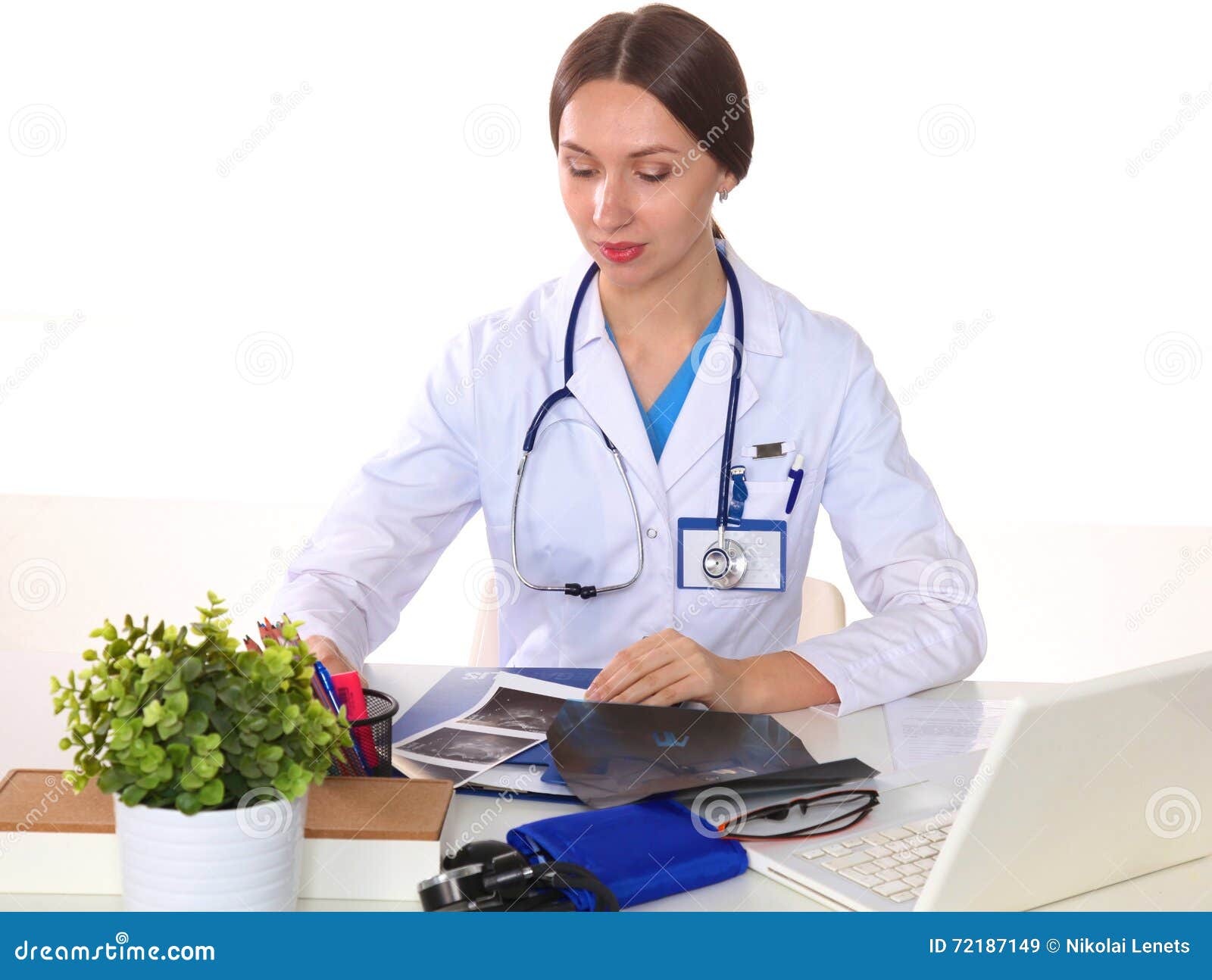 Beautiful General Practitioner is Working with Joy. she is Standing ...