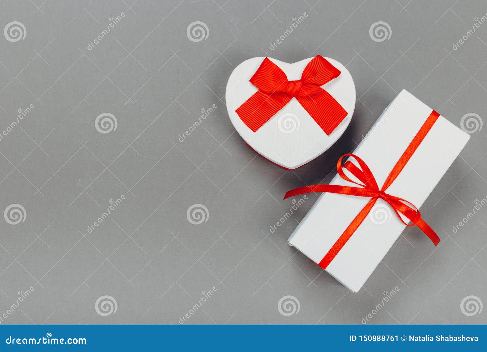 Beautiful Gift Boxes Wrapped in Paper with a Red Ribbon and a Bow on a ...