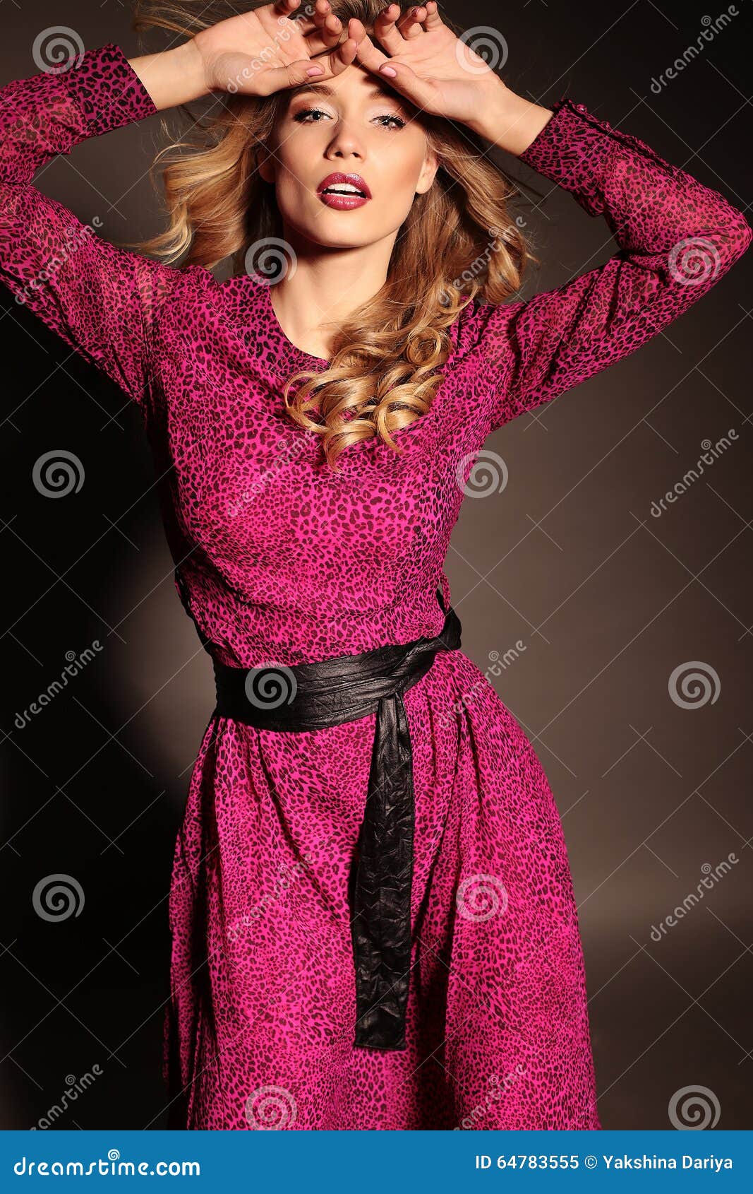Beautiful Girl With Blond Curly Hair And Bright Evening Makeup Wears