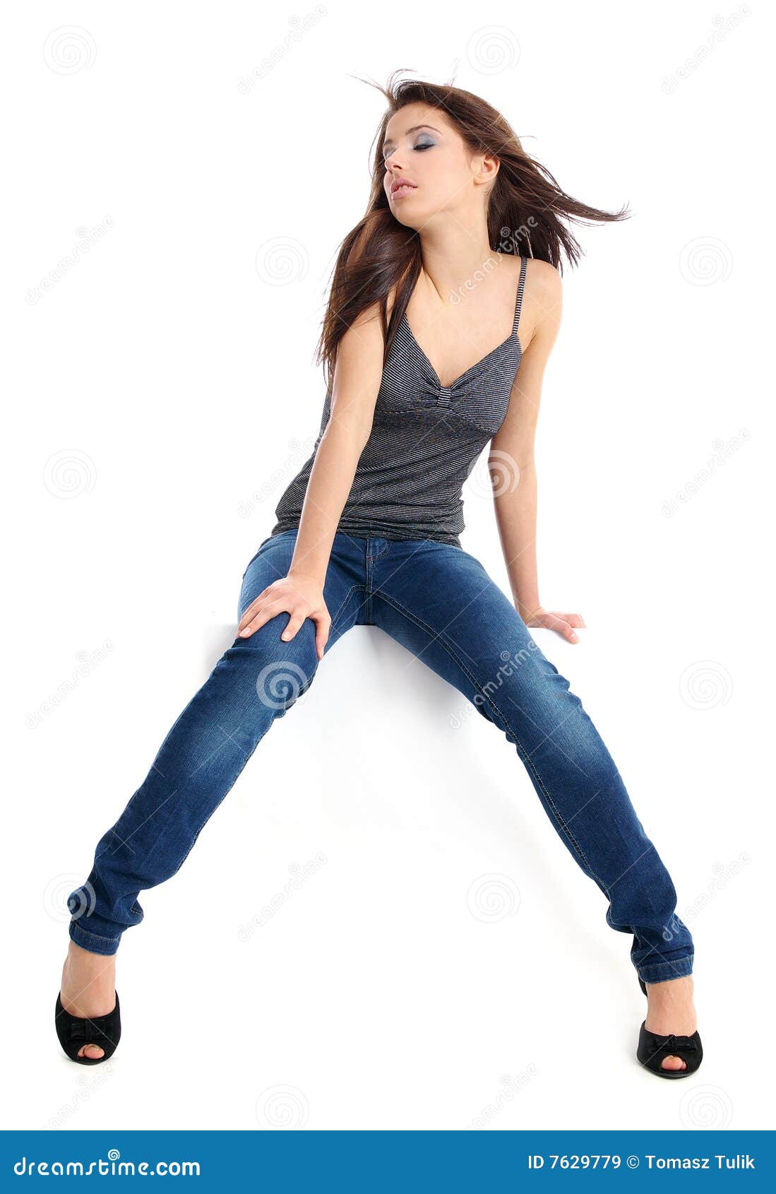 Beautiful Girl in Blue Jeans Stock Image - Image of legs, pose: 7629779