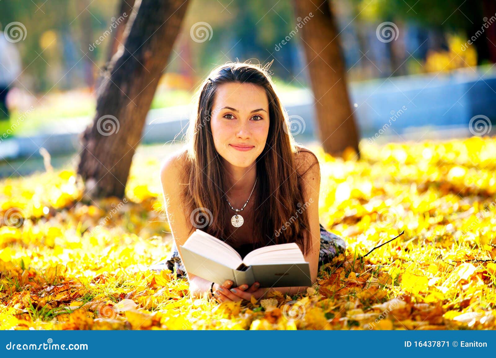 Beautiful girl with book stock image. Image of book, park - 16437871