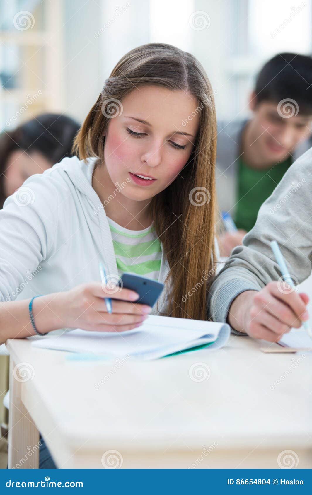 Beautiful Girl Calculating Numbers in Classroom Stock Photo - Image of ... Beautiful Girl Calculating Numbers in Classroom Stock Photo - Image of ...