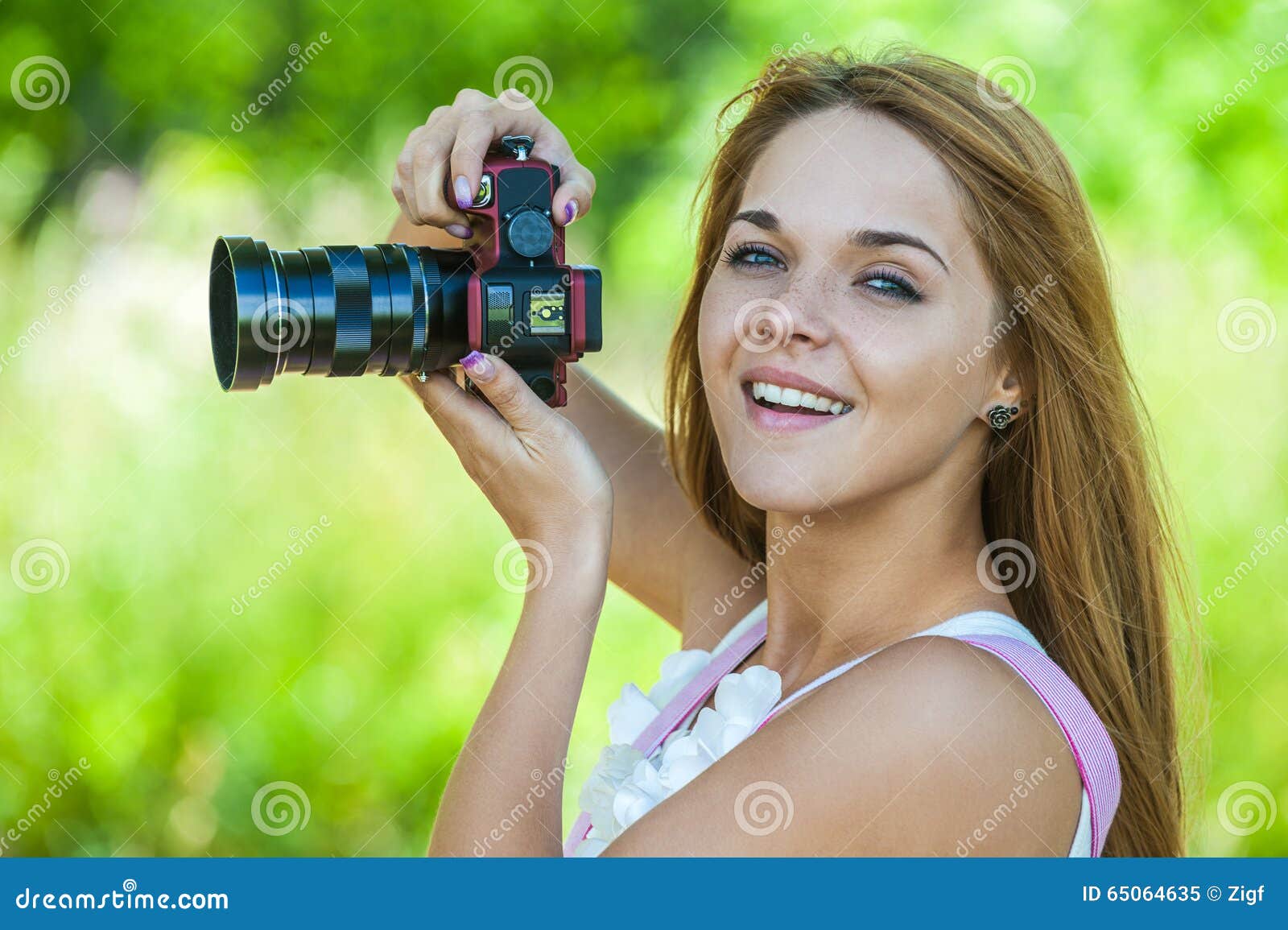 Beautiful girl with camera stock image. Image of nature - 65064635