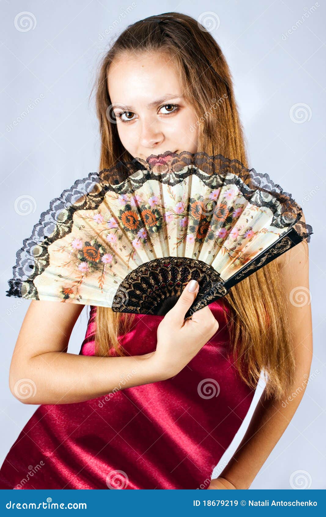 Beautiful girl with a fan. stock image. Image of dress - 18679219