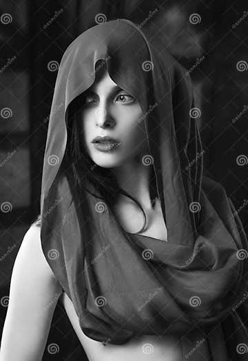 Beautiful Girl With Fashionable Makeup Wearing A Silk Scarf Thrown