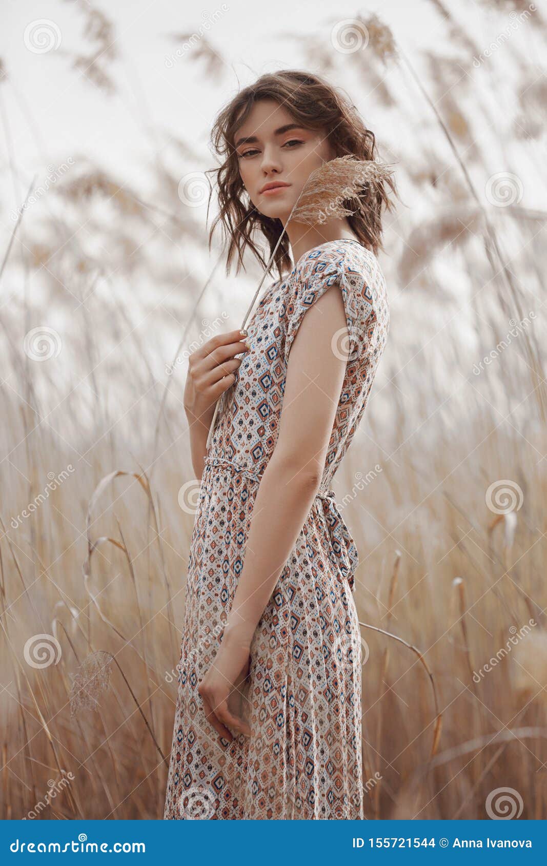 Beautiful Girl In A Field With Tall Grass In Autumn Art Portrait Of A