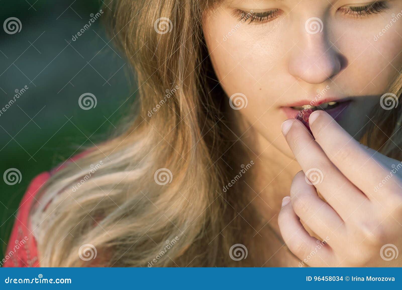 A Beautiful Girl Has a Raspberry Stock Photo - Image of cute, happy ...