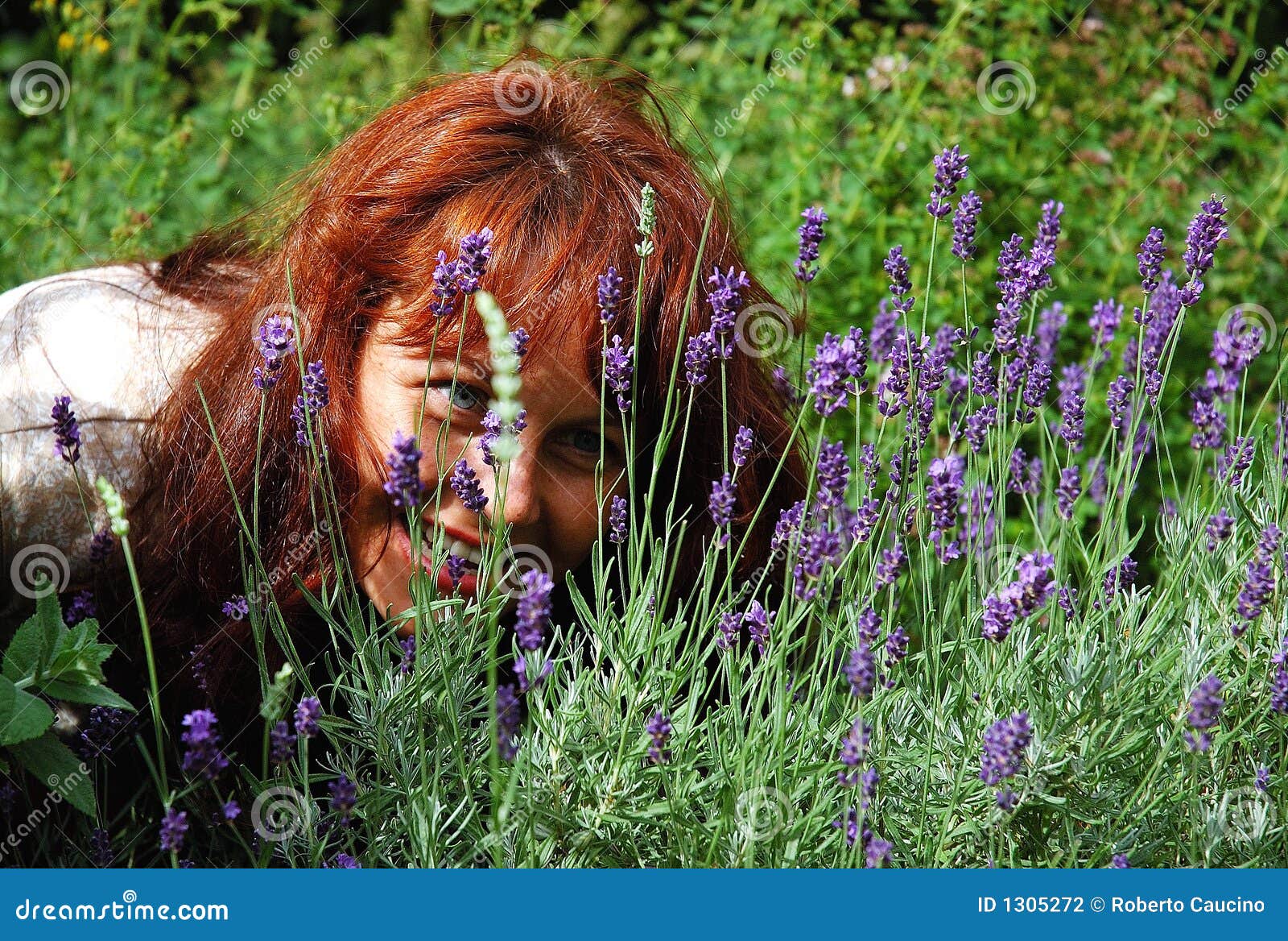 Beautiful Girl Looking at Flowers Stock Photo - Image of girl, people ...