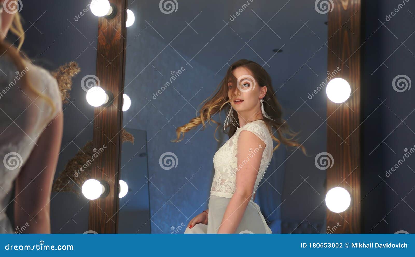 Beautiful Girl Model Posing in Front of a Mirror. Stock Photo - Image ...