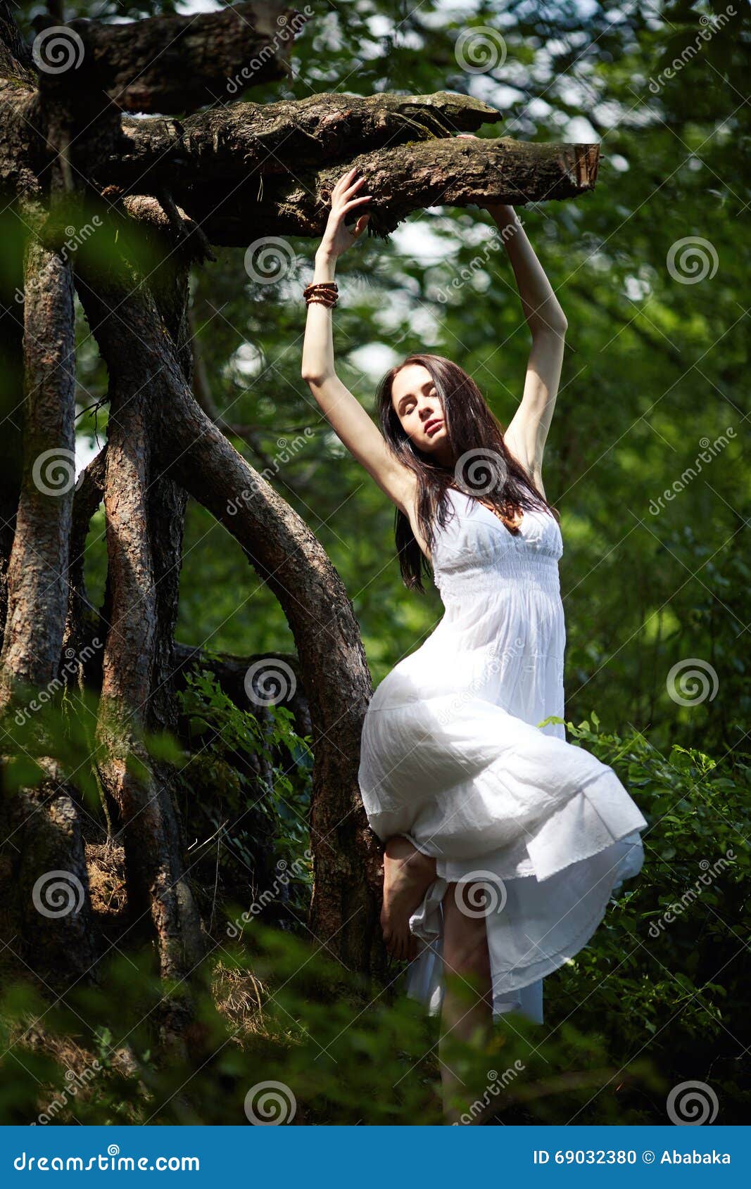 Beautiful girl on old tree stock photo. Image of pretty - 69032380