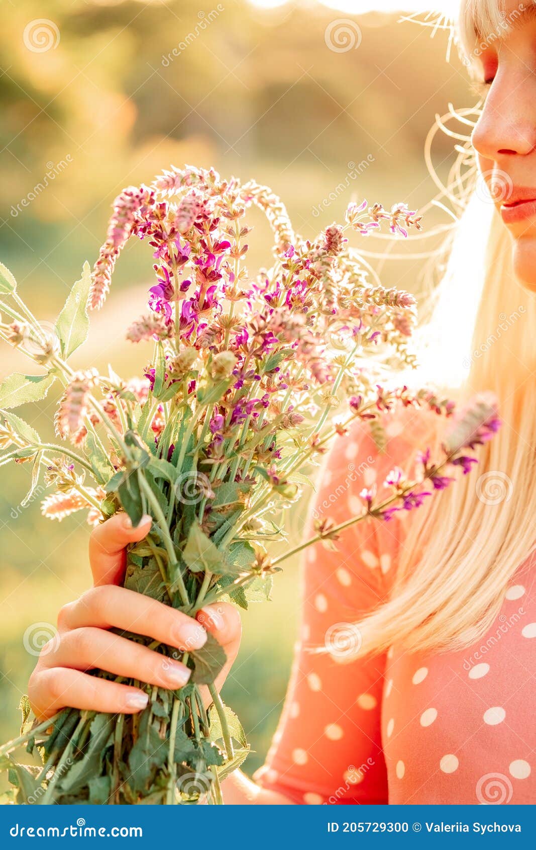 Beautiful Girl In A Pink Dress And A Straw Hat On A Picnic In A Spring