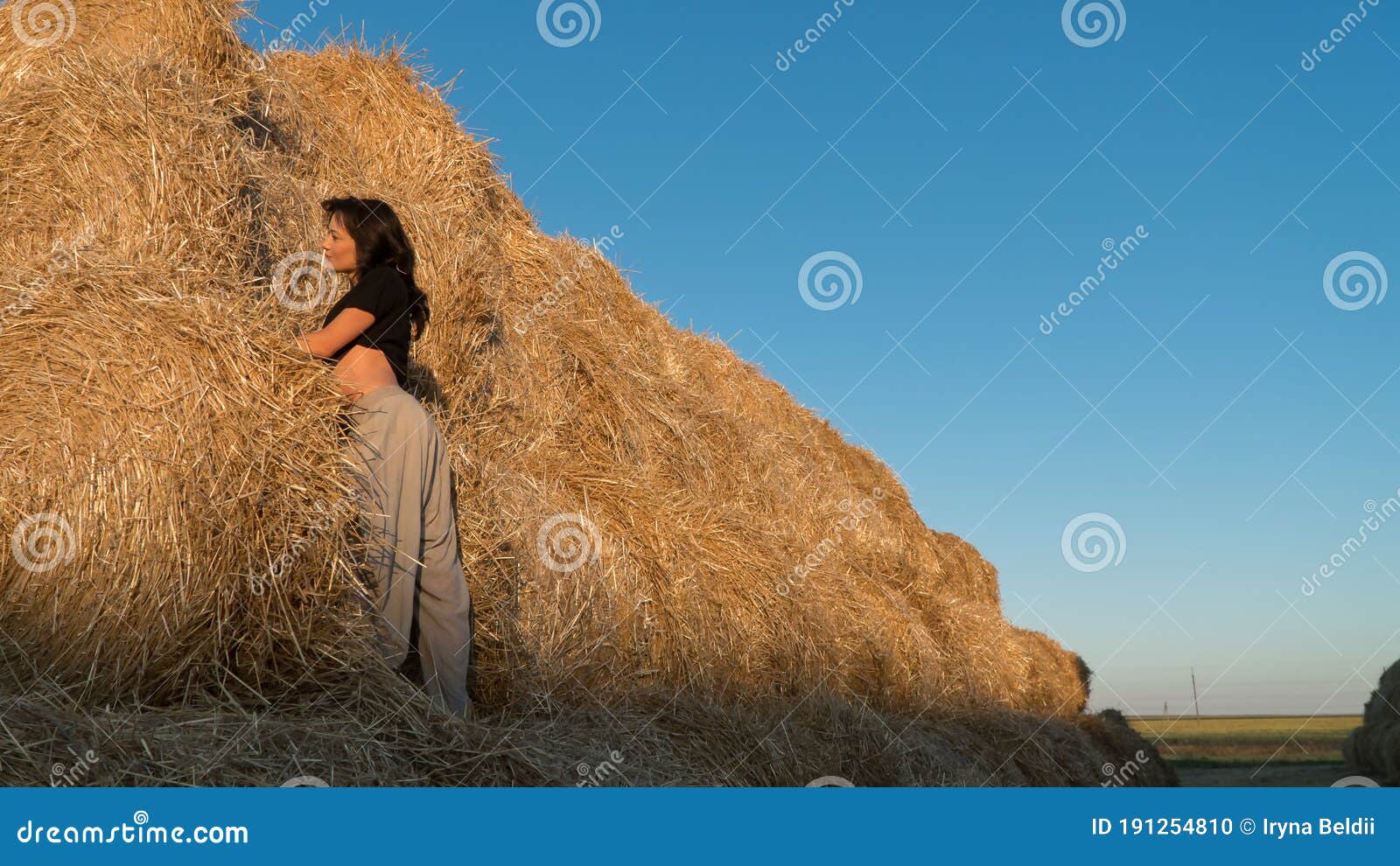 Beautiful Girl Posing on a Haystack. Stock Photo - Image of hayloftn ...