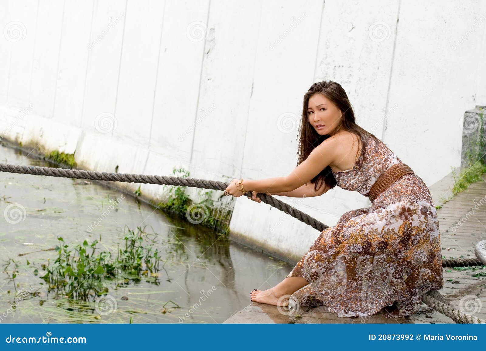 Beautiful Girl Pulling a Rope Stock Photo - Image of dress, cute: 20873992