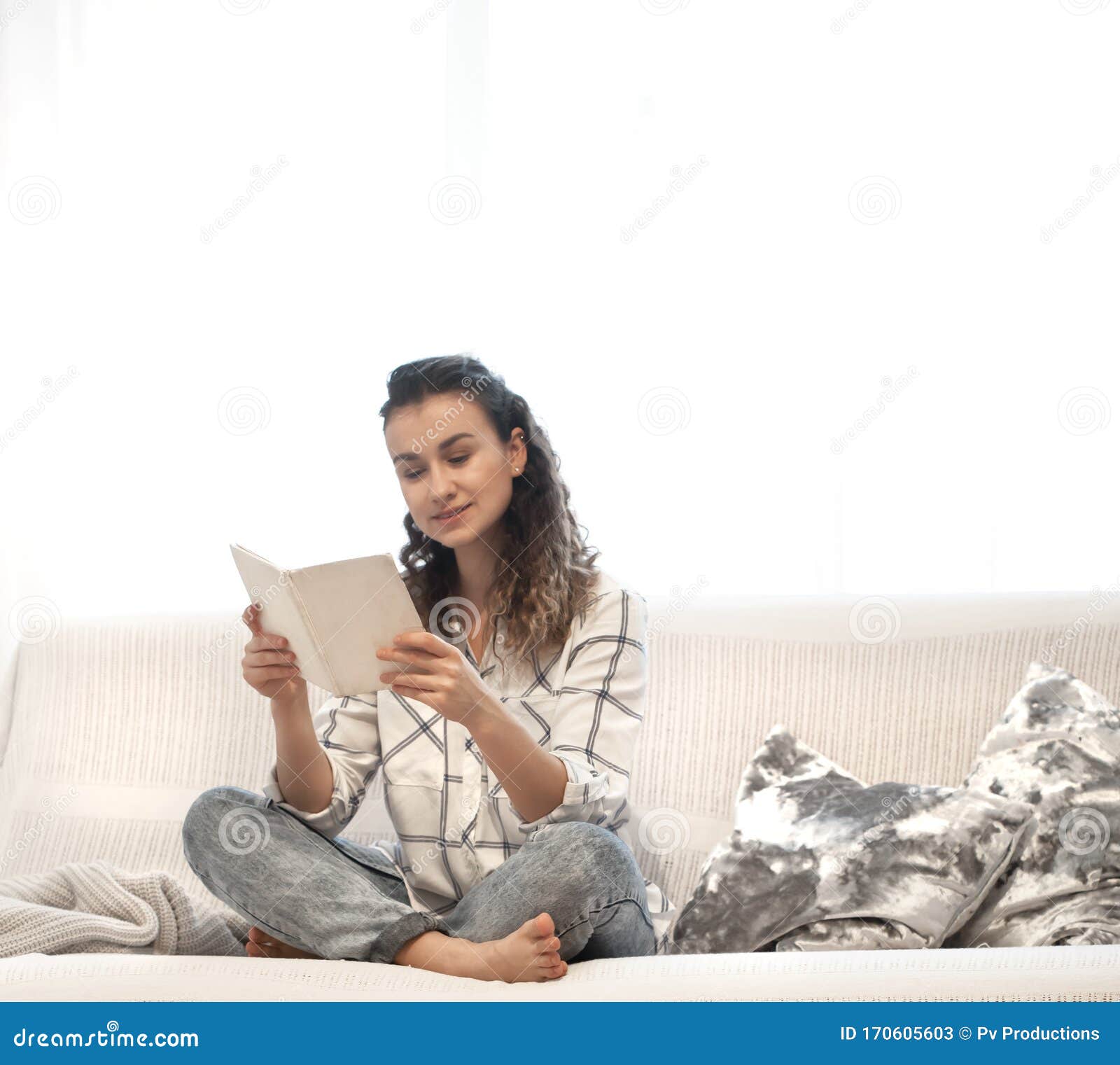 Beautiful Girl Reading A Book Sitting On The Couch Stock Image Image