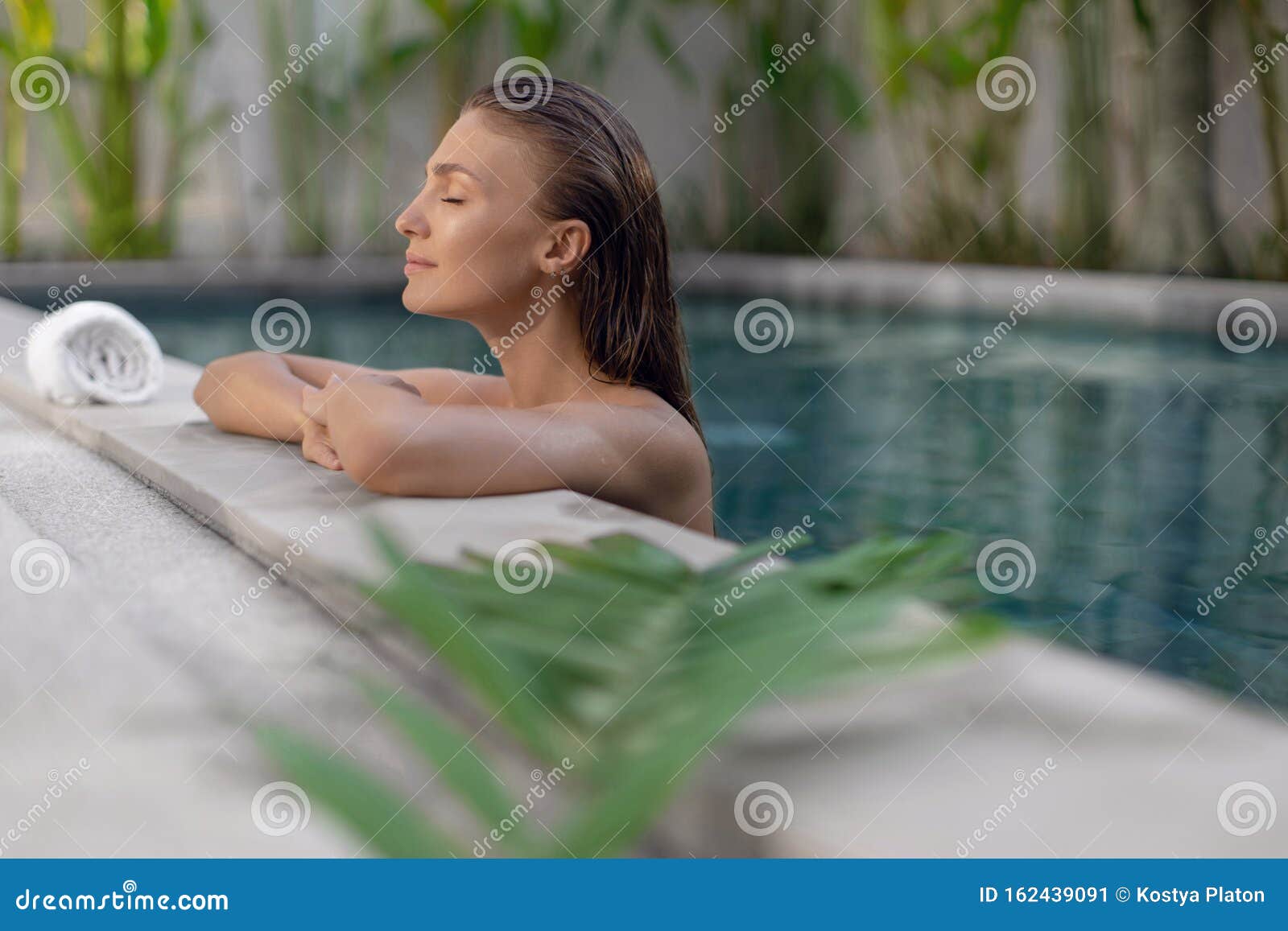 Beautiful Girl Relaxes Around The Pool Spa Stock Image Image Of