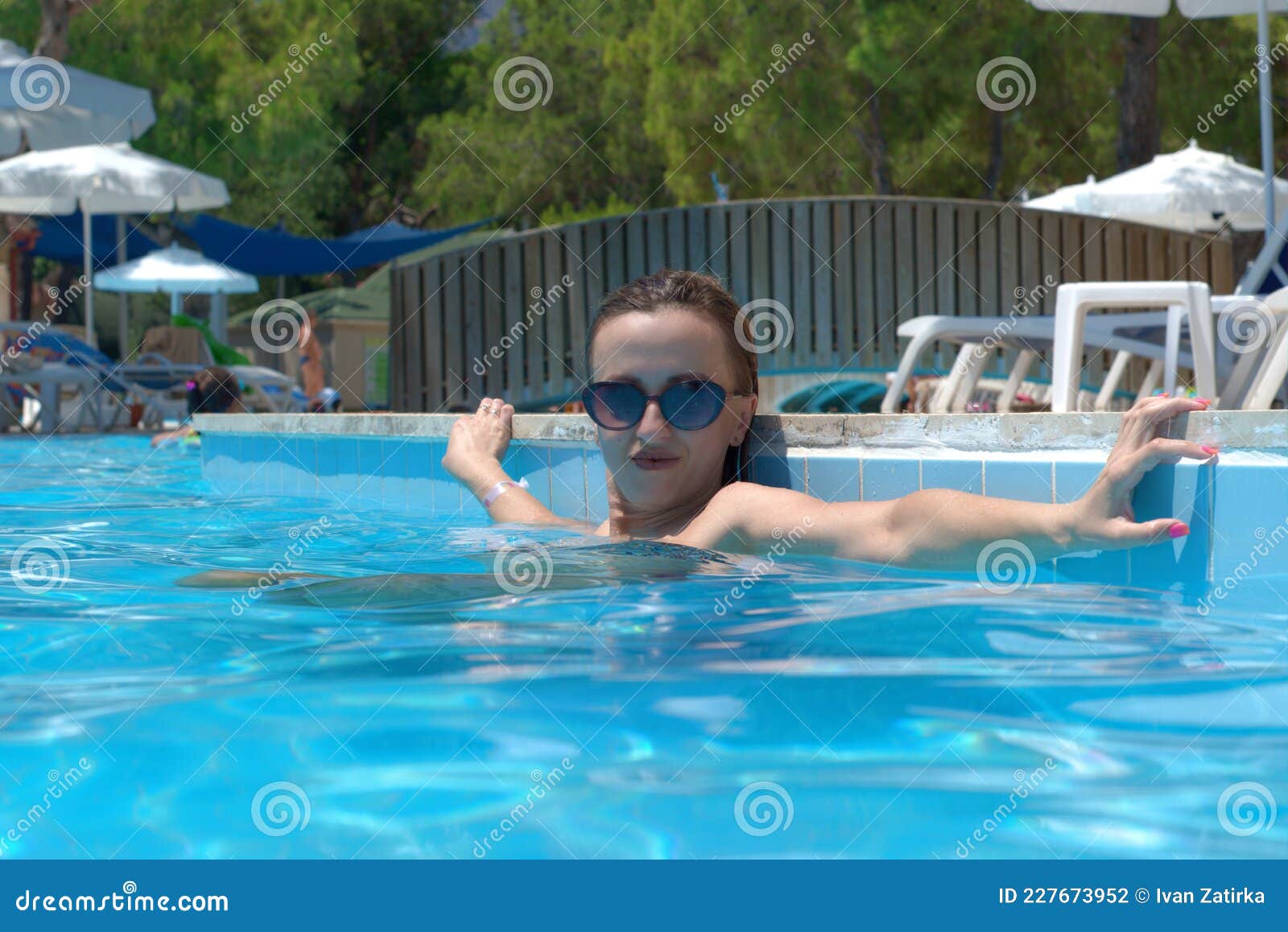 Beautiful Girl Resting in the Pool Stock Photo - Image of trees ...