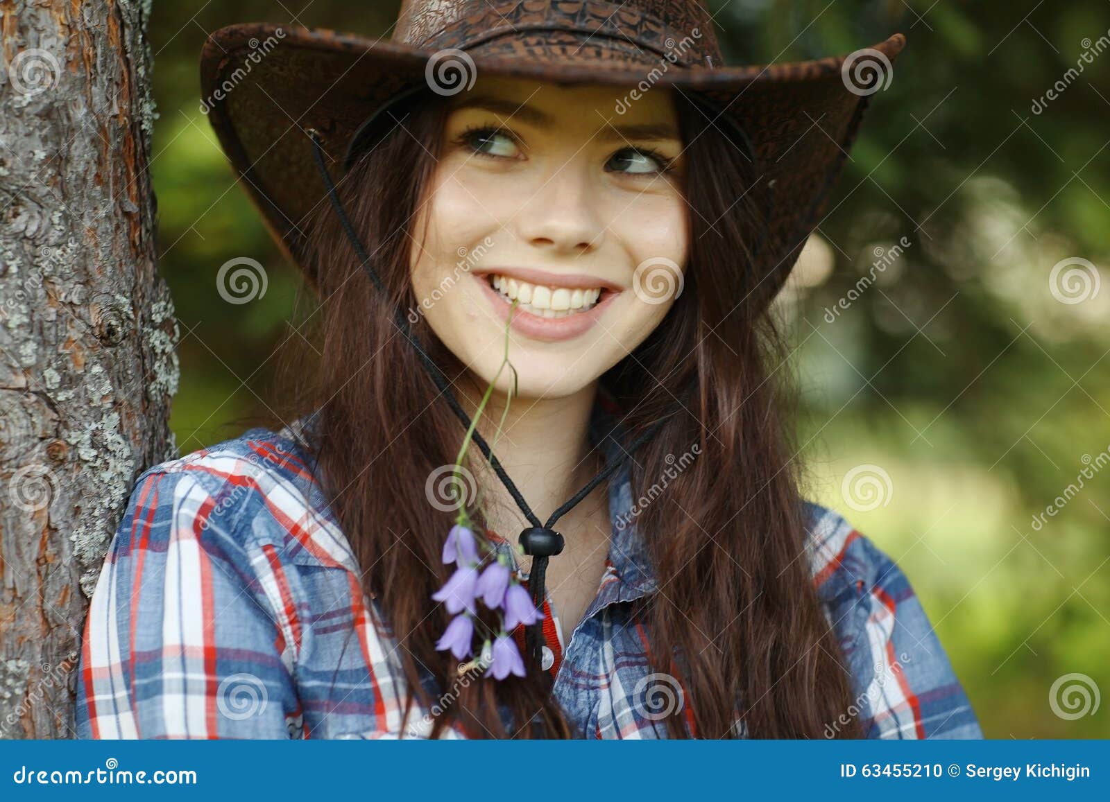 A Girl In A Rustic Old-fashioned Dress Goes Holding A Rake Over A Rural ...