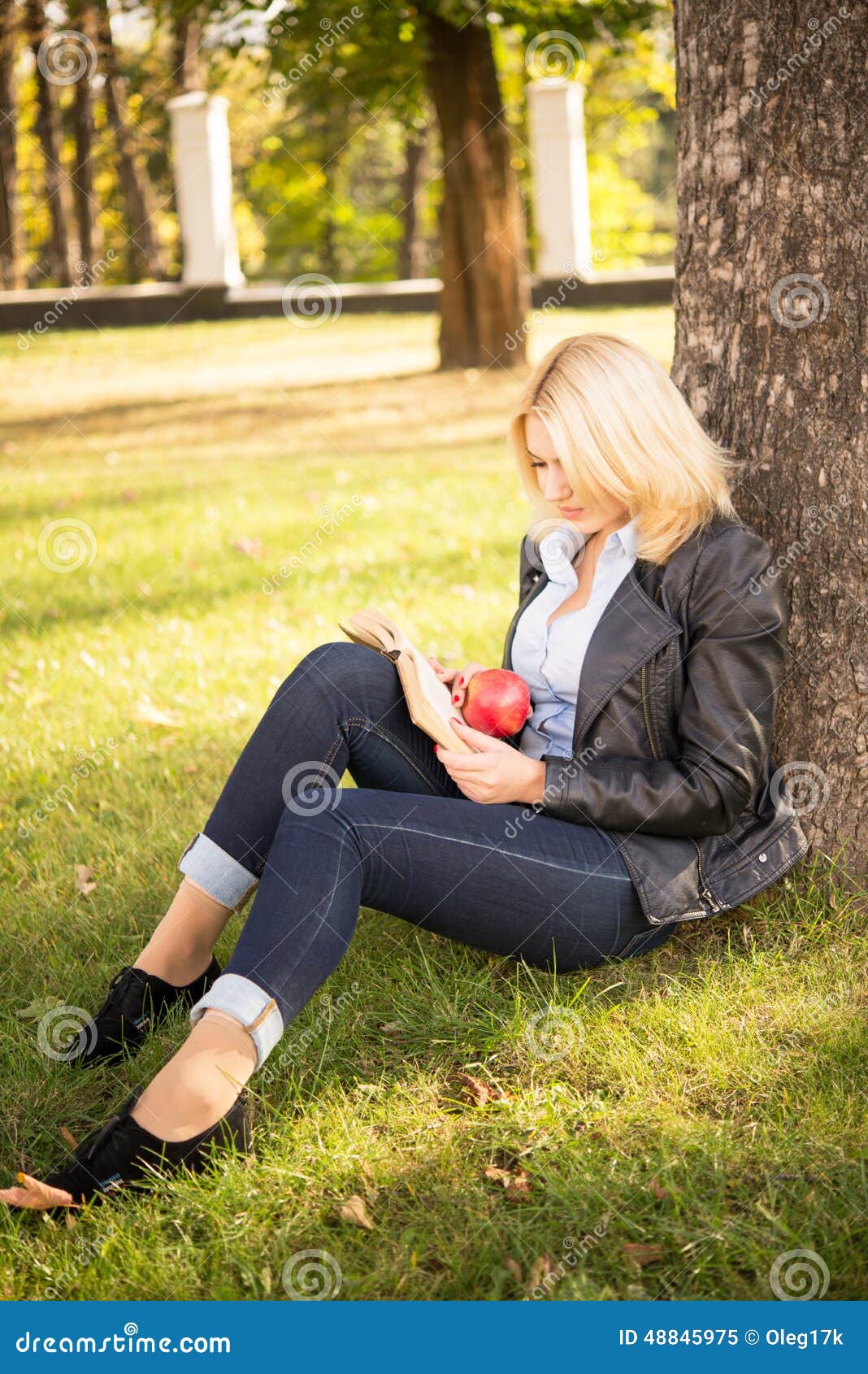 Beautiful Girl Sitting Under A Tree And Reading A Book Stock Image ...