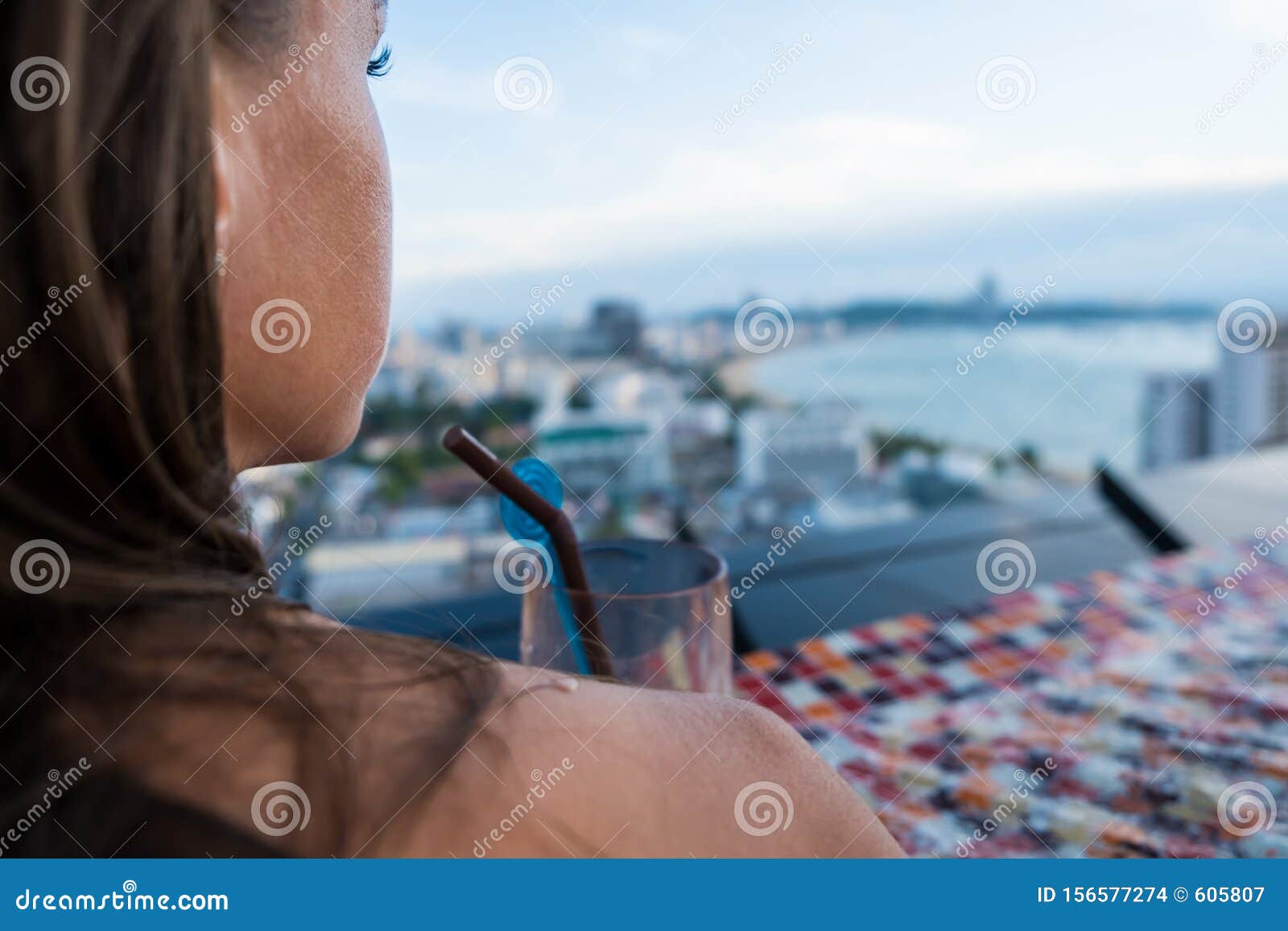 Beautiful Girl In Sunglasses With A Cocktail In The Pool With Panoramic
