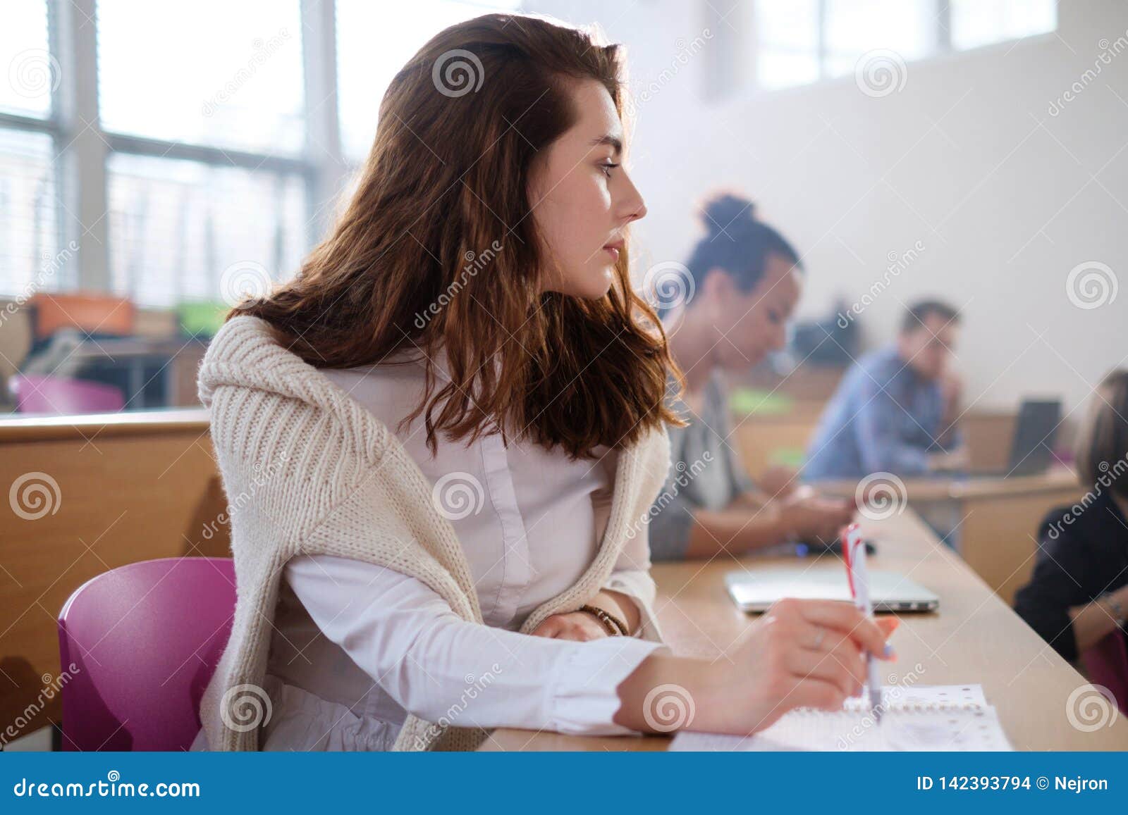 Beautiful Girl Taking Notes in Multinational Group of Students in an ...