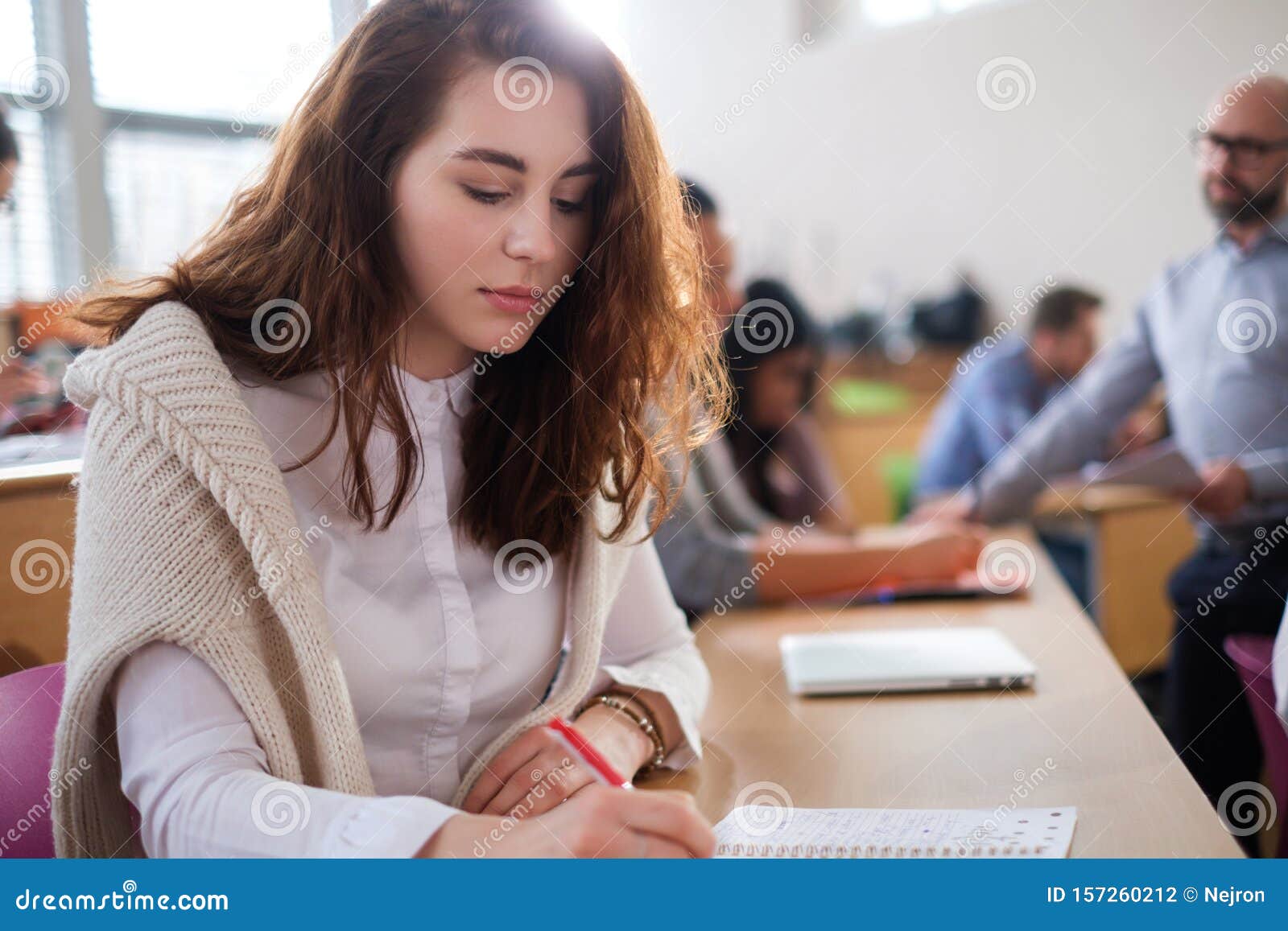 Beautiful Girl Taking Notes in Multinational Group of Students in an ...
