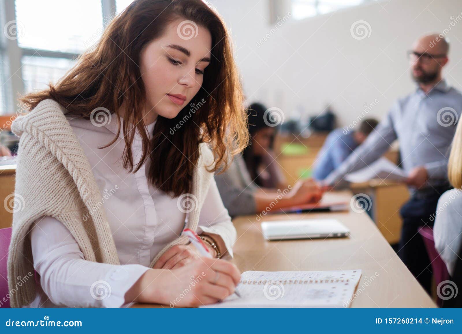 Beautiful Girl Taking Notes in Multinational Group of Students in an ...
