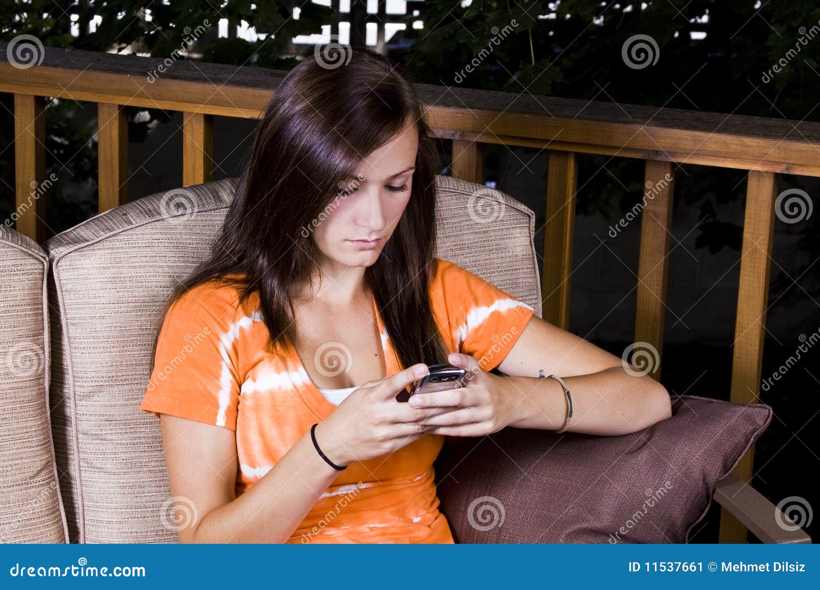 Beautiful Girl Texting in the Patio Stock Image - Image of sitting ...