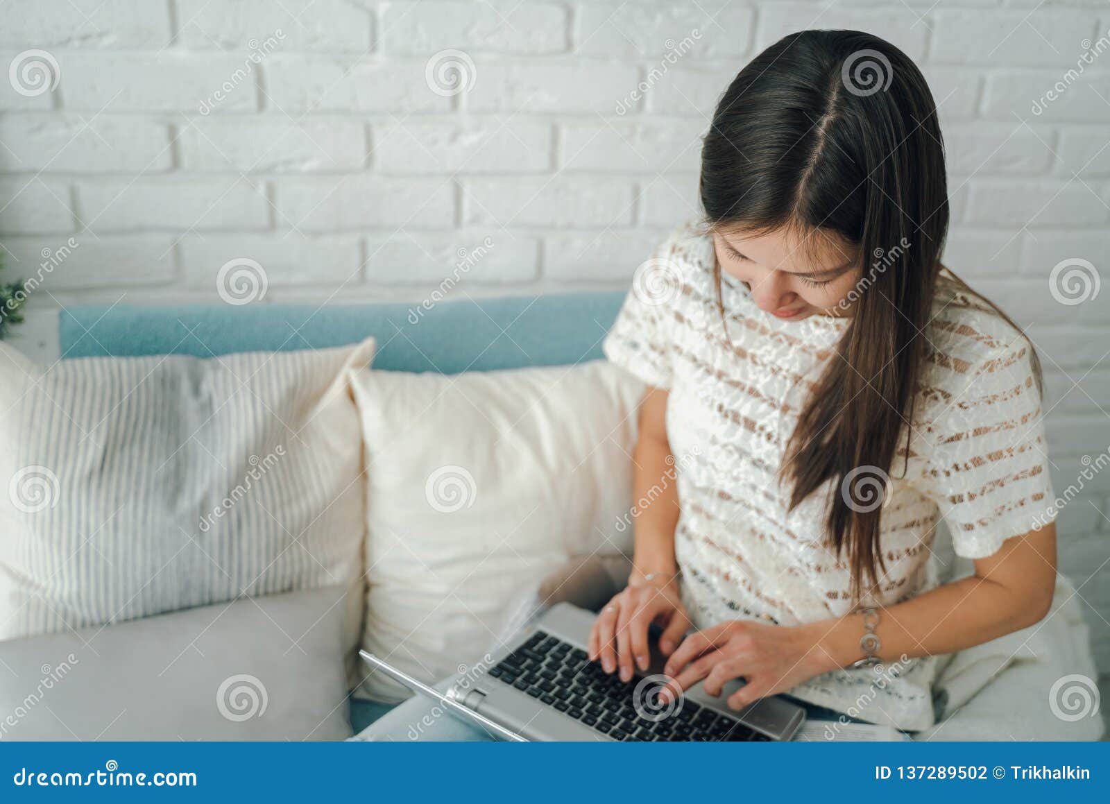 Beautiful Girl is Typing on a Laptop. Stock Photo - Image of money ...