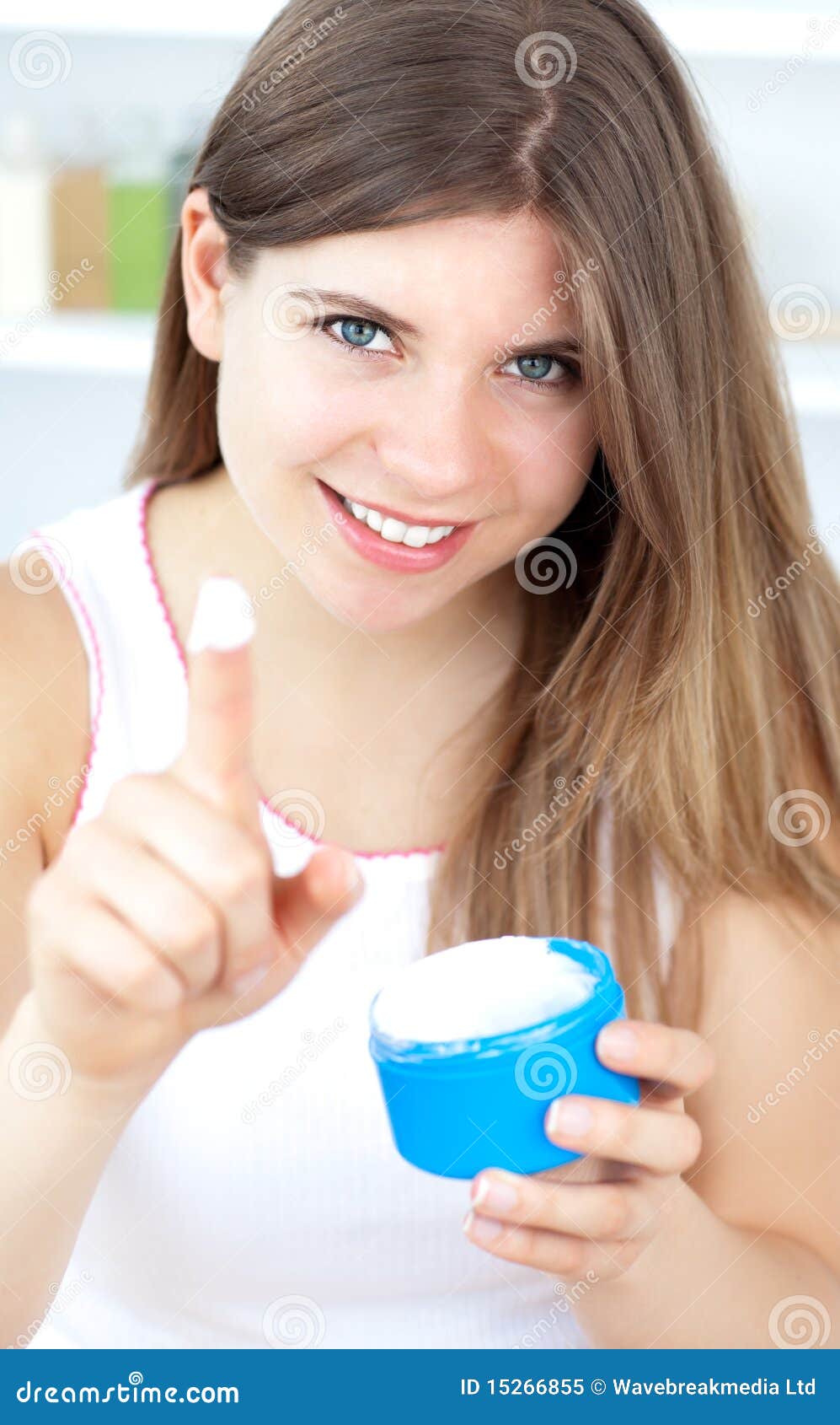 Beautiful girl using cream stock image. Image of makeup - 15266855