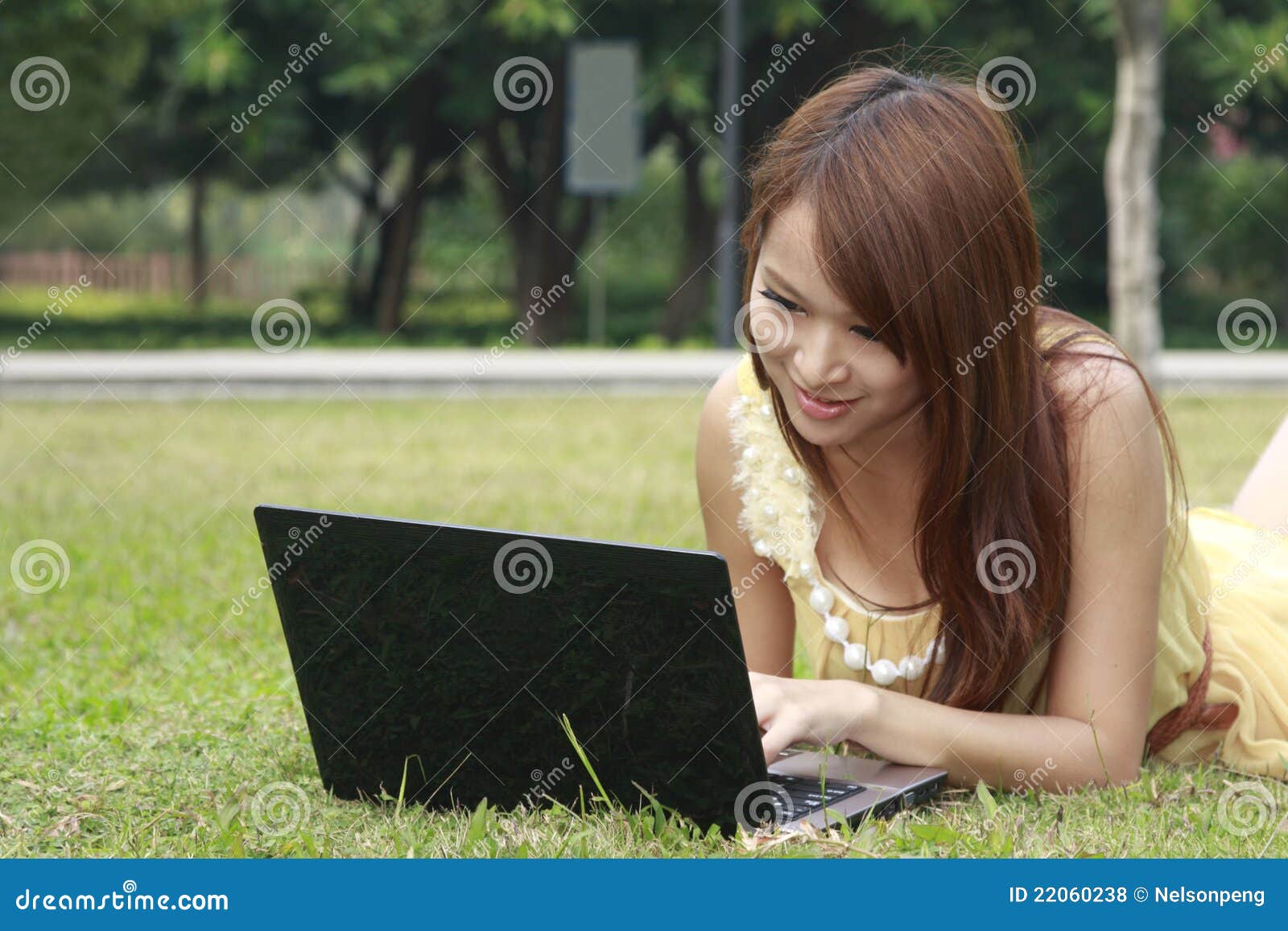 Beautiful Girl Using Laptop on Grass Stock Photo - Image of working ...