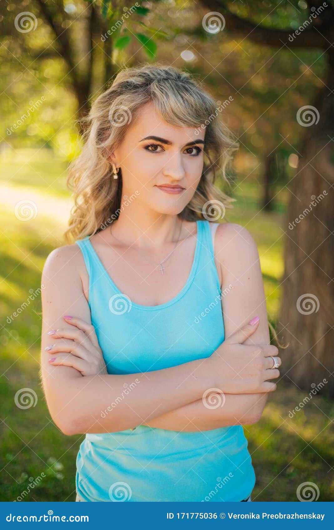 Beautiful Girl On A Walk In The Park Blonde In A Blue T Shirt In The