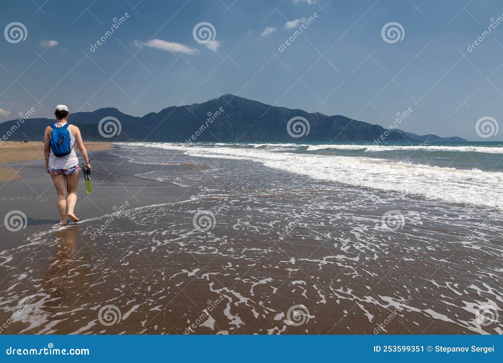 A Beautiful Girl is Walking Along the Beach. Long Sea Coast Stock Image ... A Beautiful Girl is Walking Along the Beach. Long Sea Coast Stock Image ...