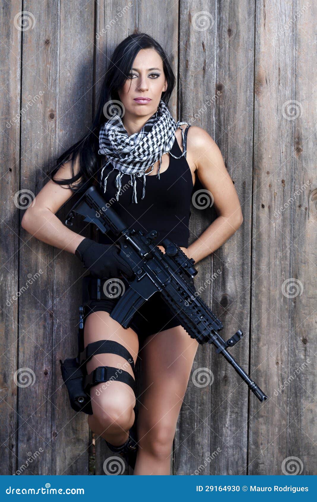 Beautiful girl with weapon stock photo. Image of scarf - 29164930