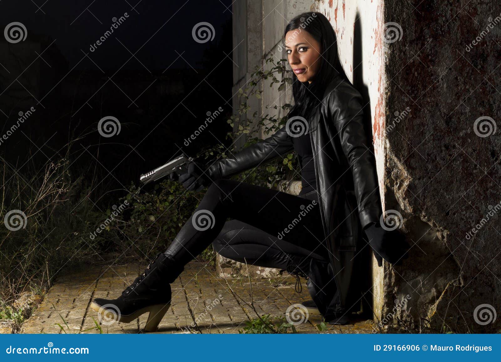 Beautiful girl with weapon stock photo. Image of wall - 29166906