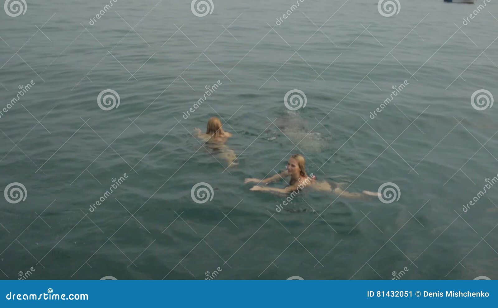 Beautiful Girls In Bikinis Swimming And Diving Into The Sea Stock Video