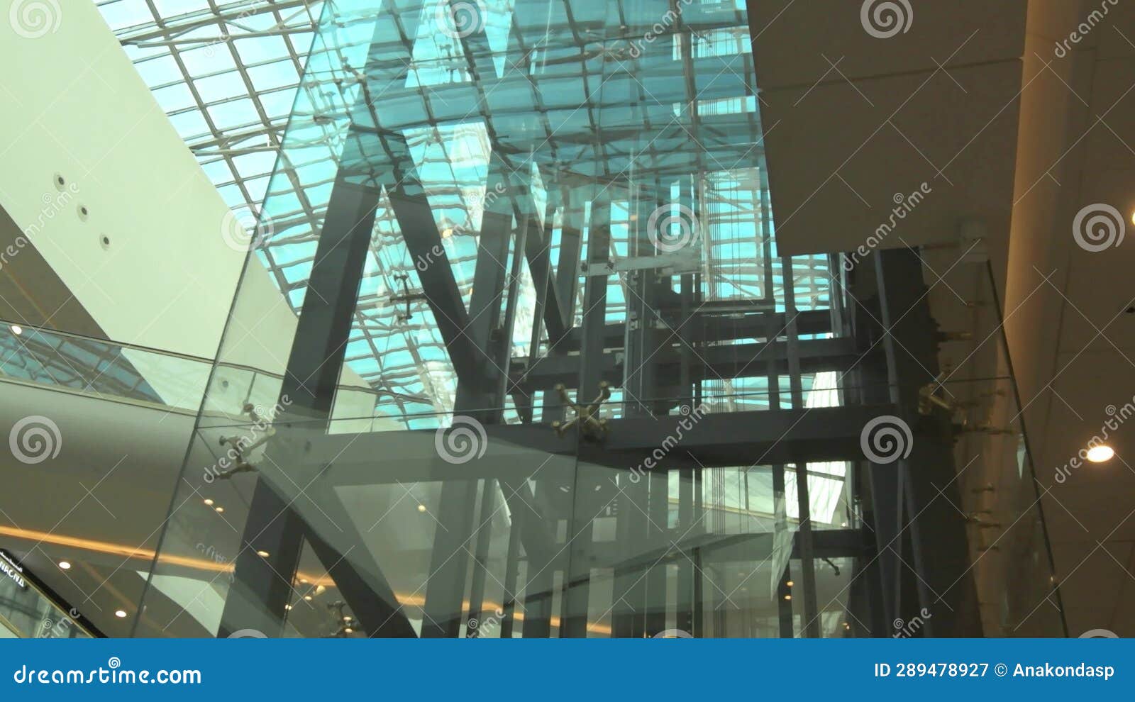 Beautiful Glass Elevator of Big Shopping Mall with Cloud Sky through ...